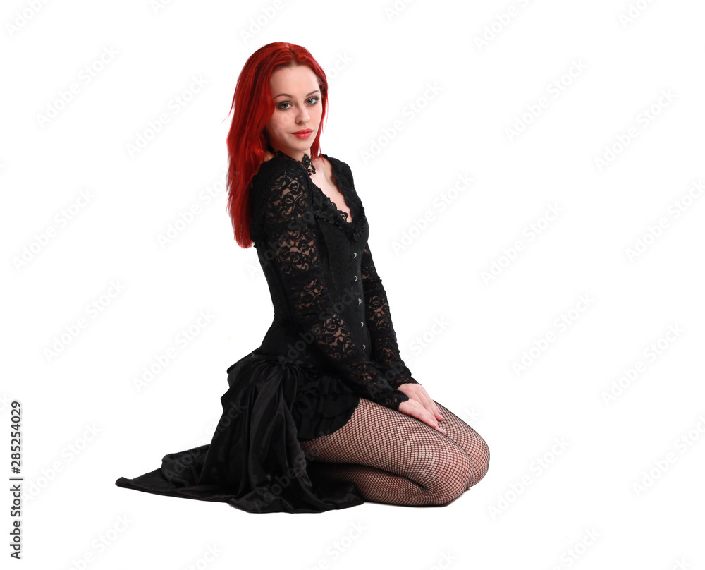 full length portrait of a red haired girl wearing a black gothic gown ...