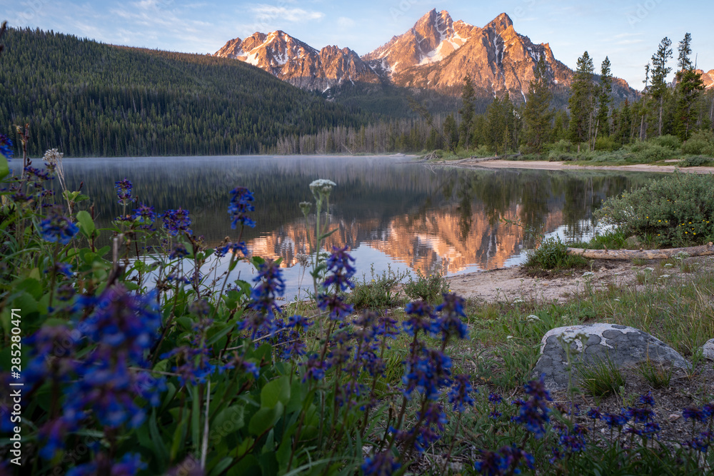 Beautiful sunrise at Stanley Lake in the Sawtooth Mountains of Idaho. Reflection in water with ...