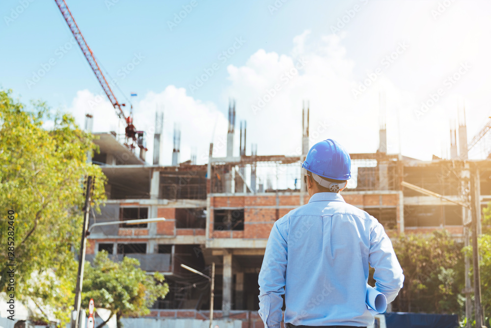 Photo & Art Print Asian man civil engineer wearing blue safety helmet ...