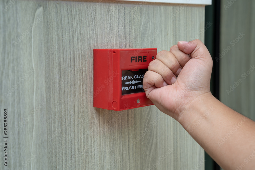 Fire alarm box with human hand action to crush the glass for emergency ...