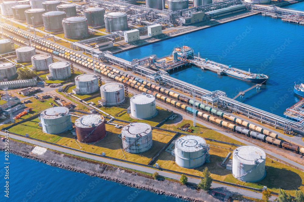 Aerial view large port oil loading terminal with large storage tanks ...
