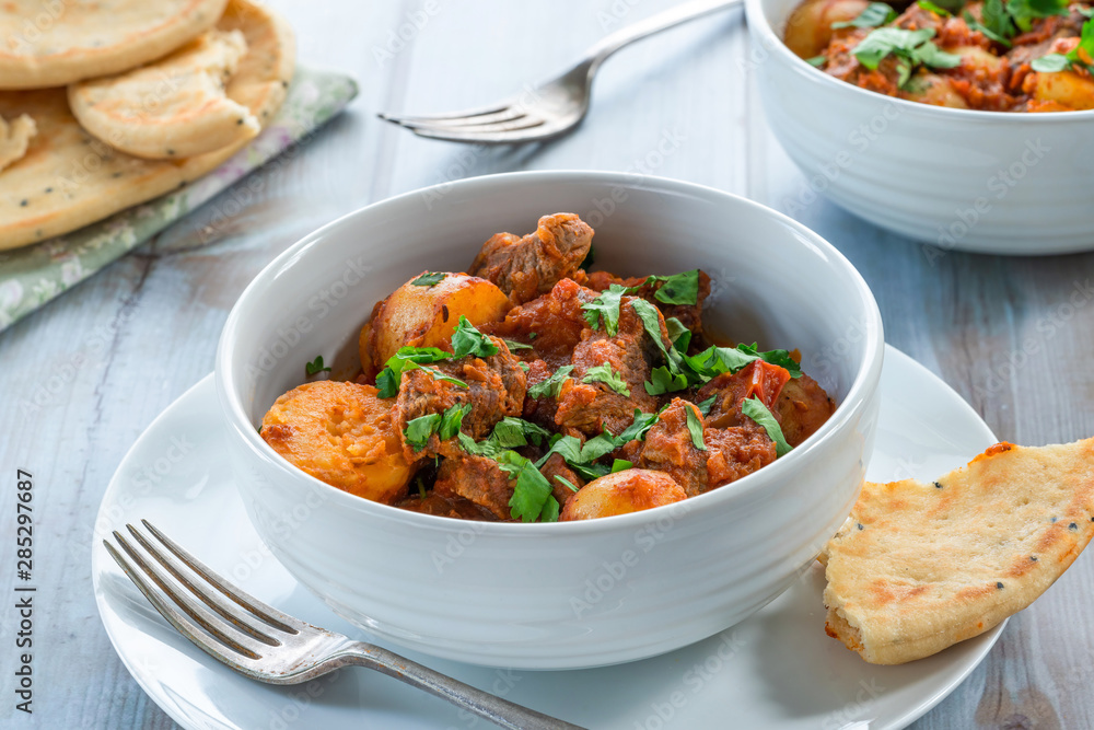 Aloo gosht with naan bread - lamb and potato curry - cuisine popular in ...
