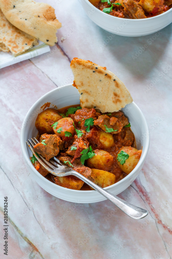 Aloo gosht with naan bread - lamb and potato curry - cuisine popular in ...