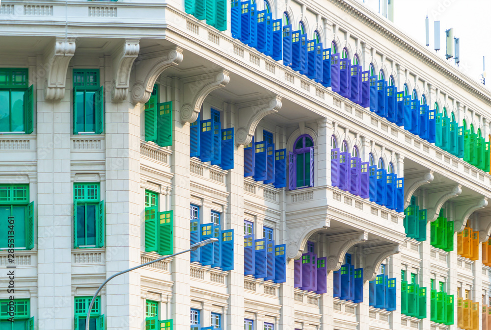 Colorful rainbow pastel building with facade windows background ...