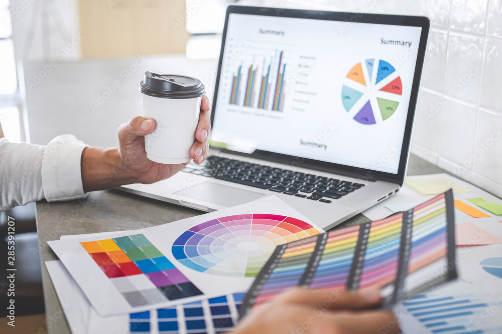 Young creative graphic designer working on project architectural ...