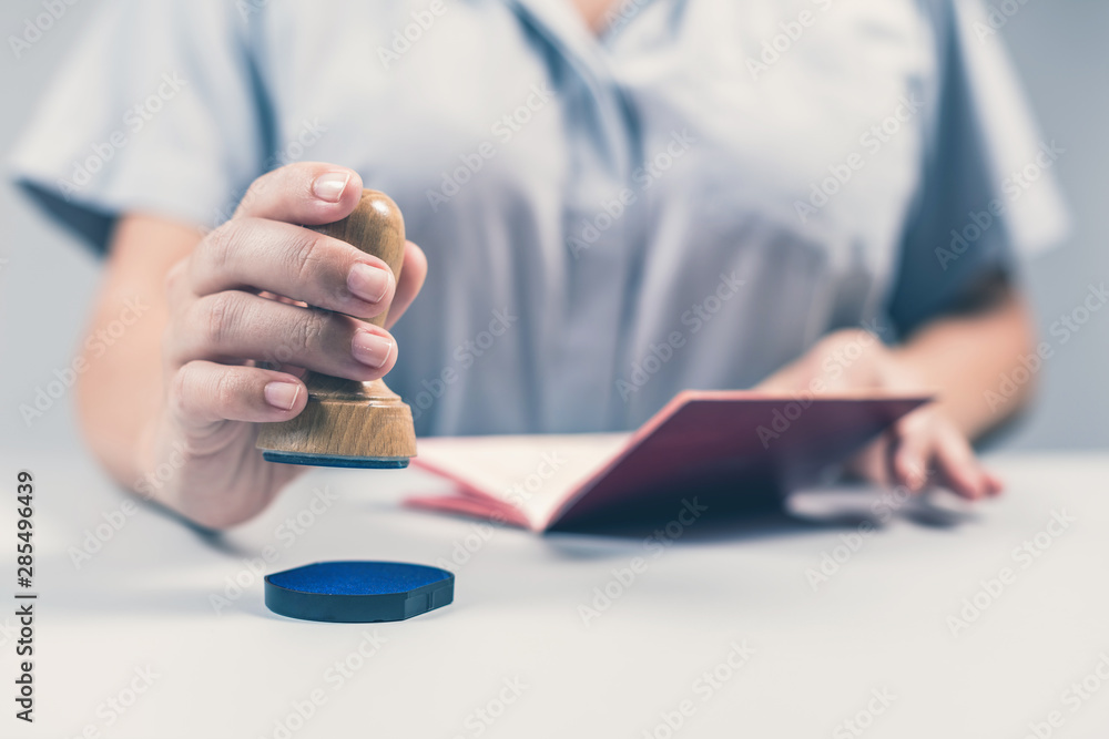 Foto de Immigration and passport control at the airport. woman border ...