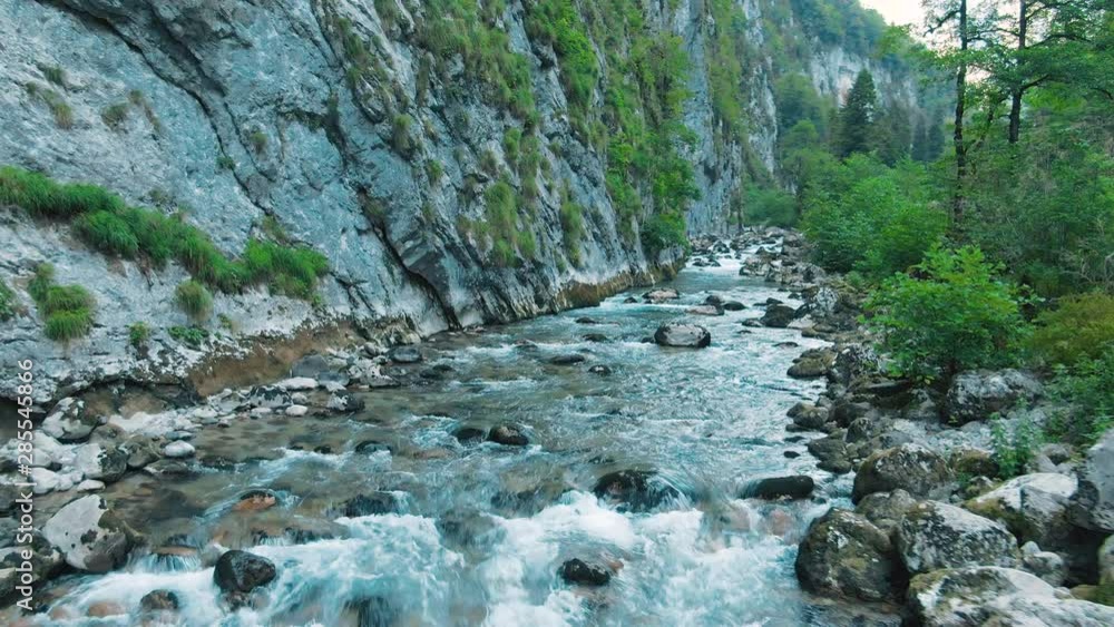 Aerial 4k Top view of a mountain river. Alpine river flows in a gorge ...