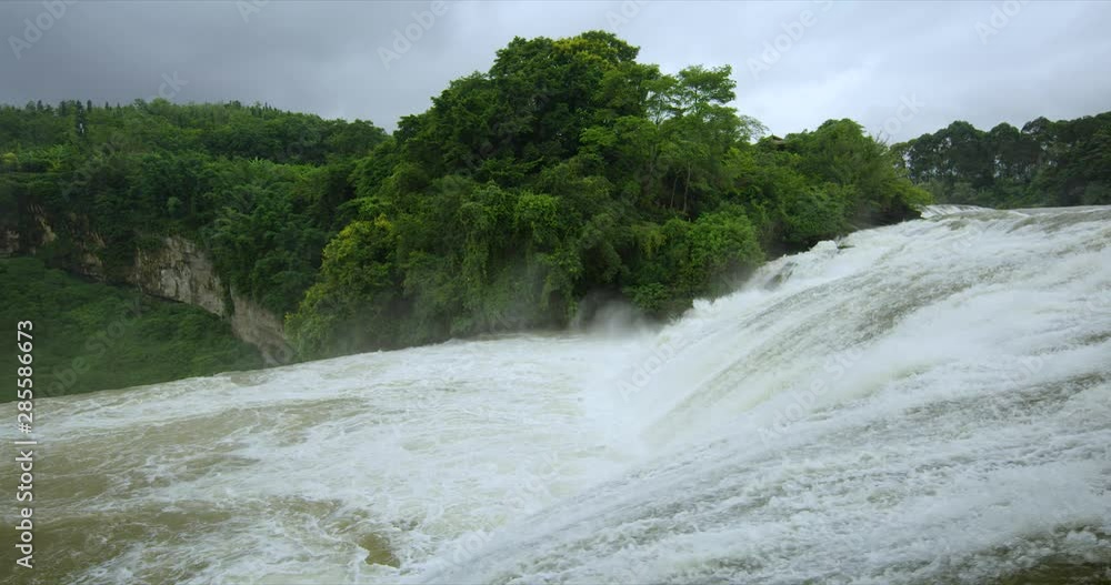 Huang Guo Shu waterfall PAN at the top, lip of falls. Scenic green ...