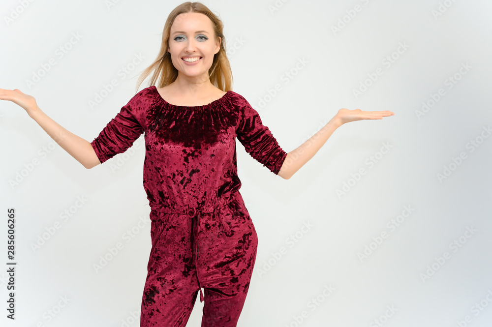 Studio knee-length portrait of a pretty beautiful young happy blonde ...