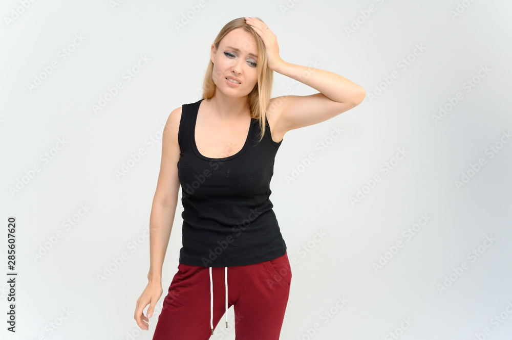 Studio knee-length portrait of a pretty beautiful young happy blonde ...