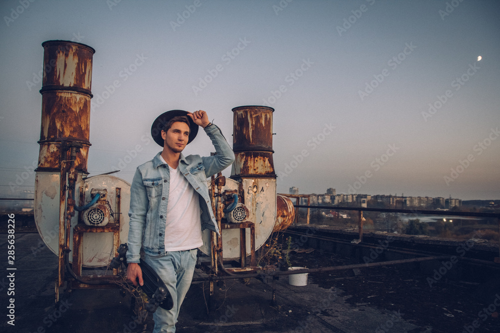 Urban man with hat and skateboard. Good looking. Cool guy. Wearing ...