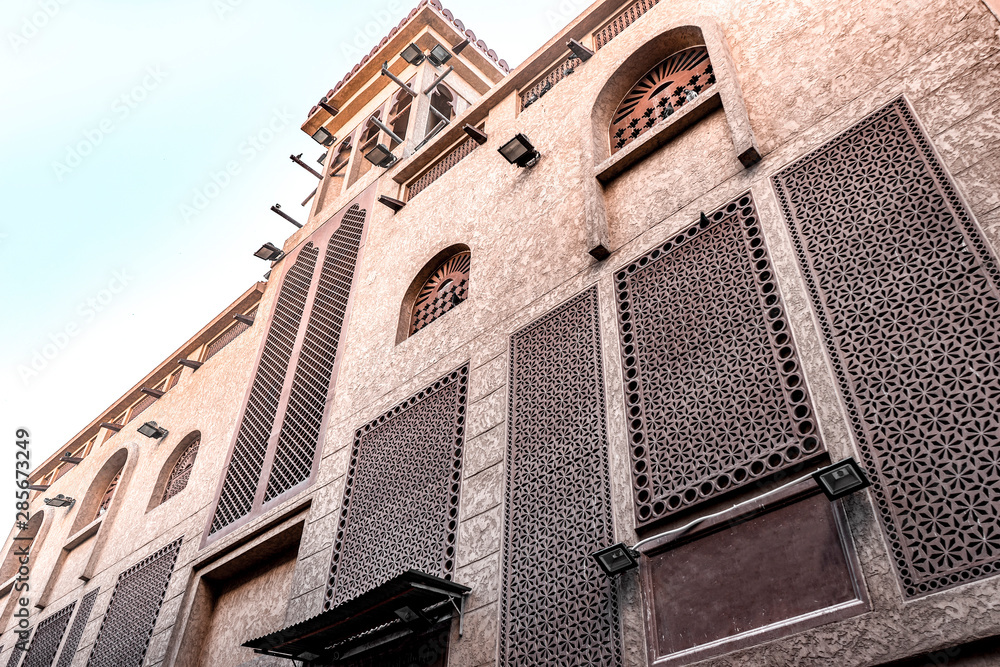 Oriental architecture with traditional Arabic patterns on the windows ...