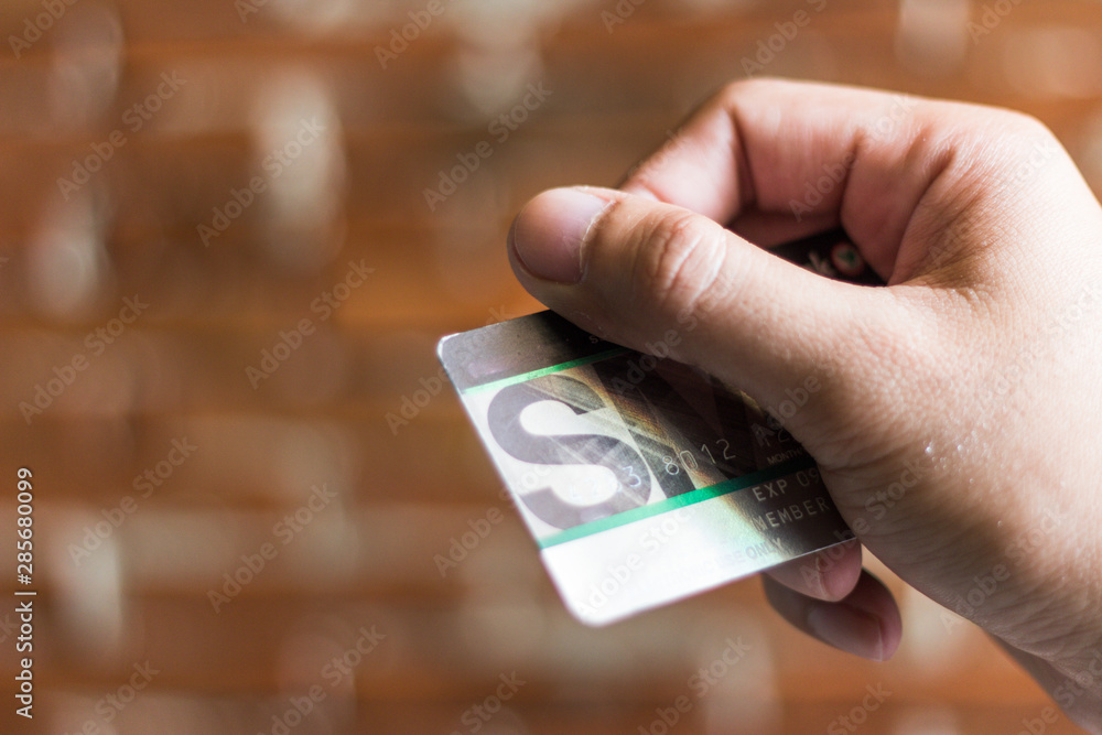 An anonymous credit card with a chip in his hand a man isolated on a ...