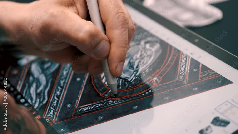 tattoo artist tracing image for new tattoo at the tattoo parlor Stock ...