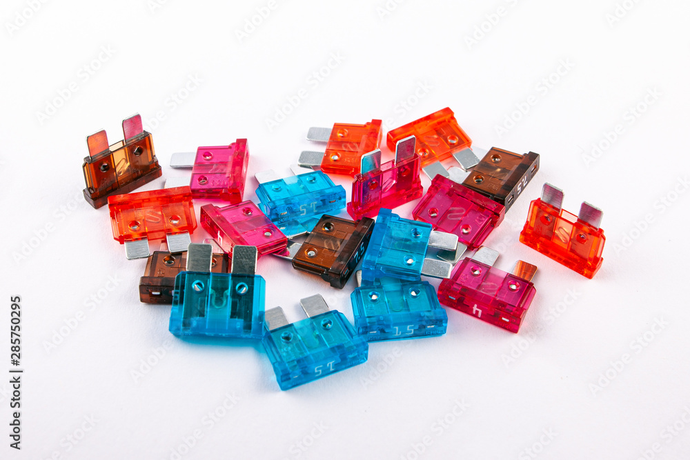 Standard ATO blade fuses with different ampers on isolated white ...