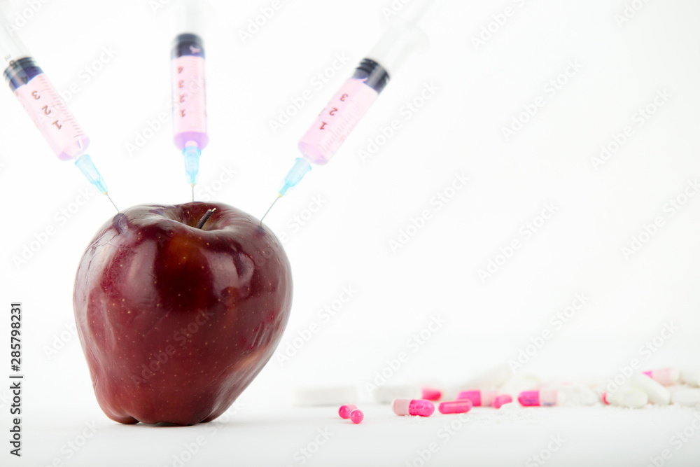 Concept: human GMO manipulation of nature and relative poisoned fruits ...