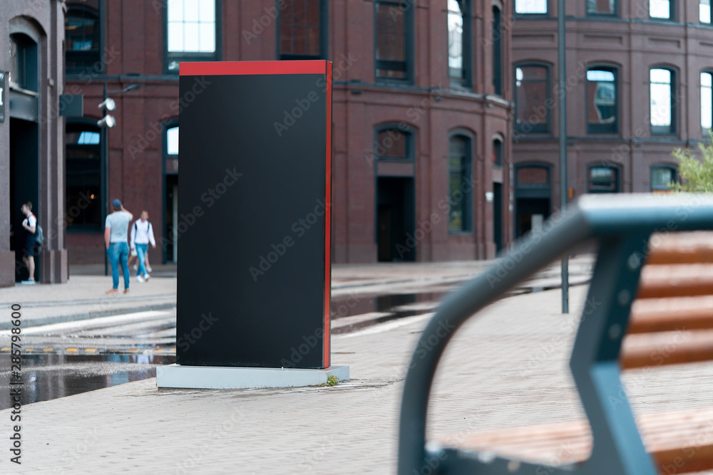 Blank black outdoor banner stand next to modern building. 3d rendering ...