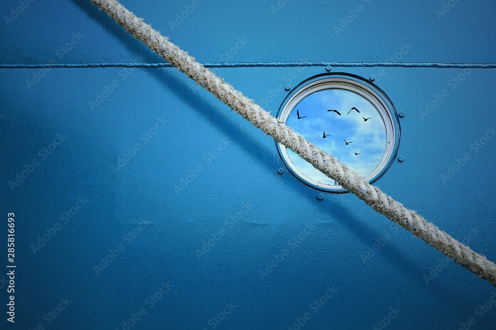 The old mooring rope and flying seagulls reflection on porthole window ...