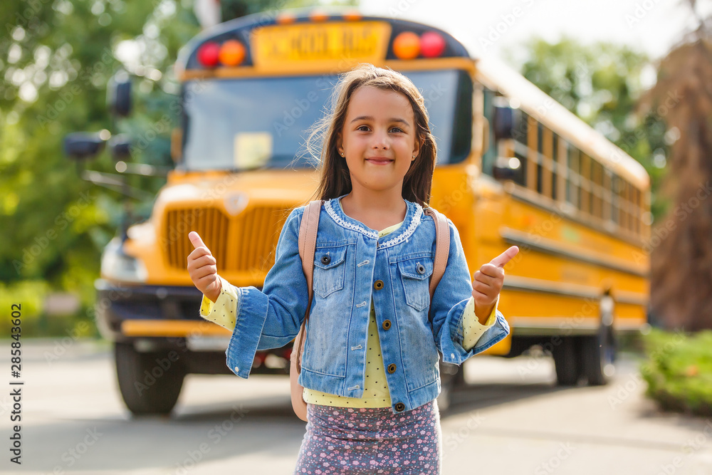 Little Girl Getting off the school bus Stock Photo | Adobe Stock