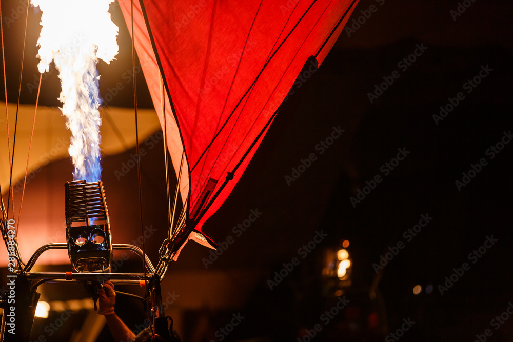 The burners on a hot air balloon firing up, sending a burst of ignited ...