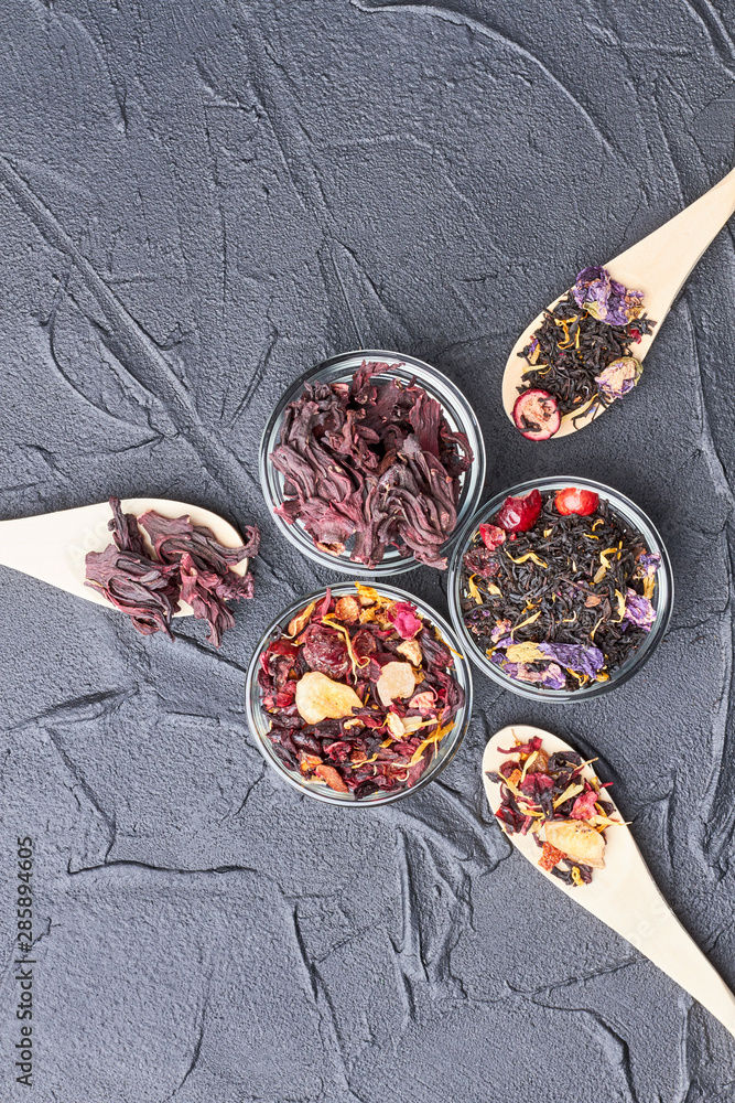 Selection of teas, top view. Hibiscus tea, green tea and fruity trea in ...