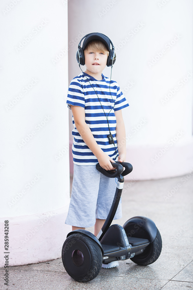 Cute little boy driving segway. Child skating on hyroboard. Boy driving ...
