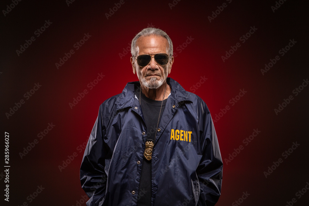 Detective wearing badge around his neck and sunglasses showing up for ...