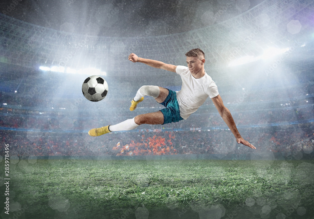 Foto de Soccer player on a football field in dynamic action at summer ...
