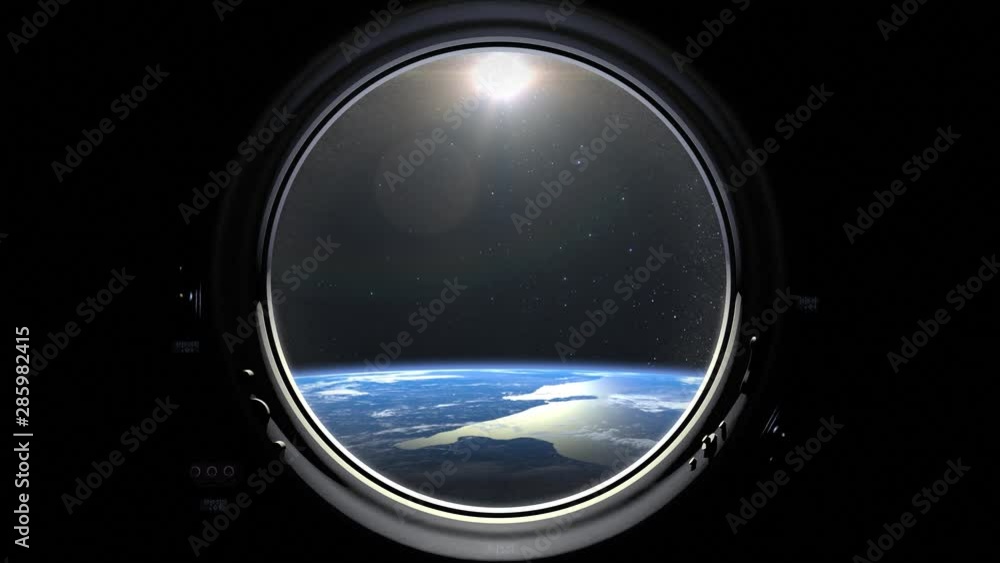 The spaceship is approaching the earth. View from the porthole ...