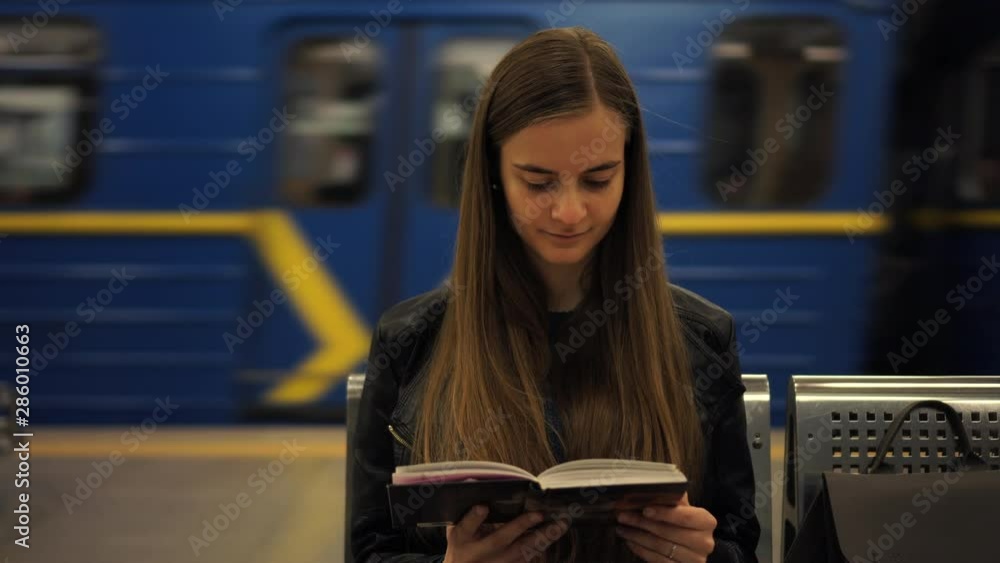 Beautiful Girl Reading a Book While Waiting For the Train, at The Train ...