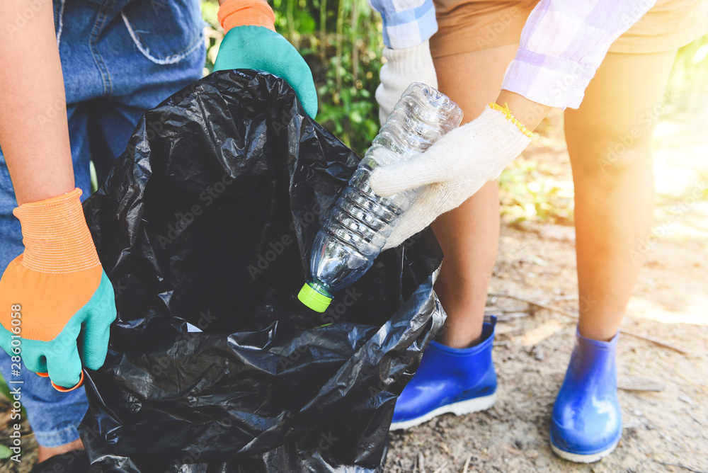Group of young women volunteers helping to keep nature clean and ...