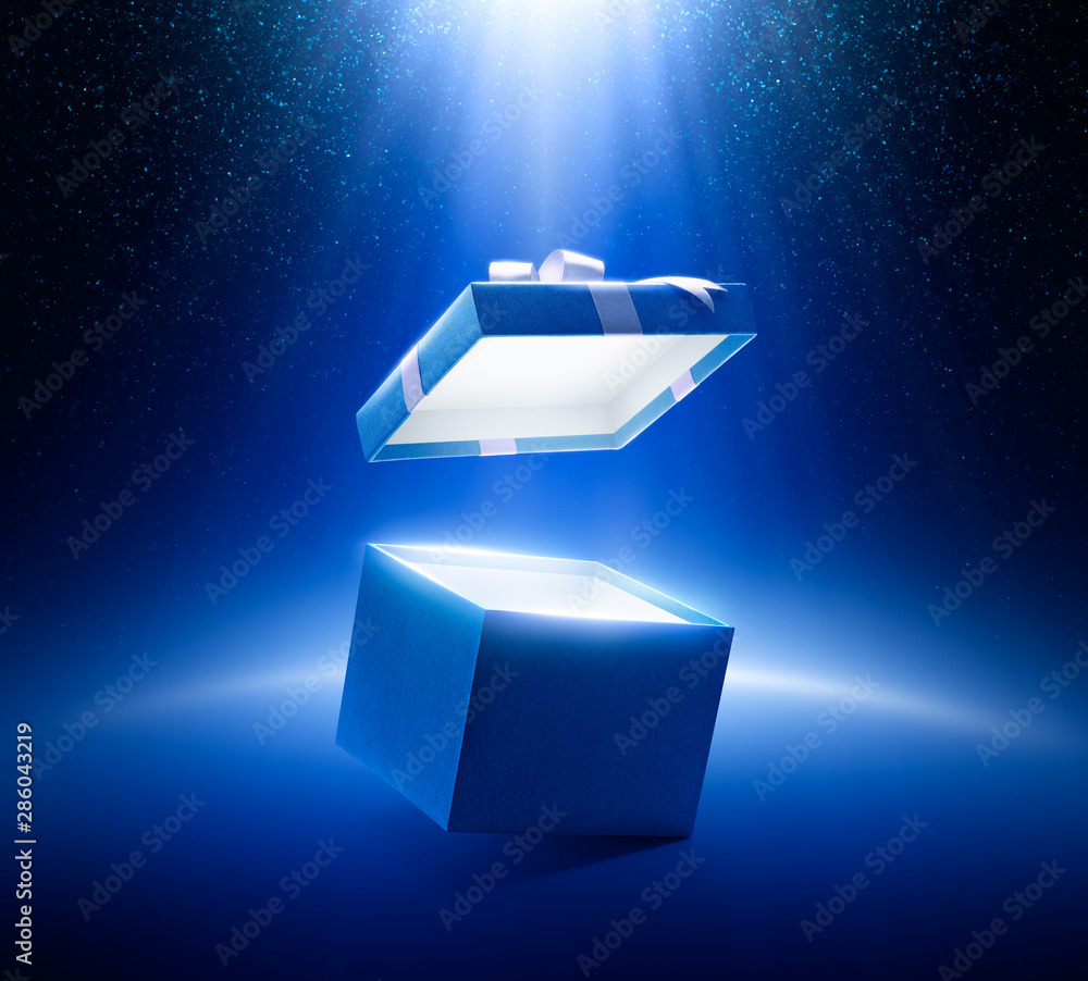 Blue open gift box on glittering background Stock Photo | Adobe Stock
