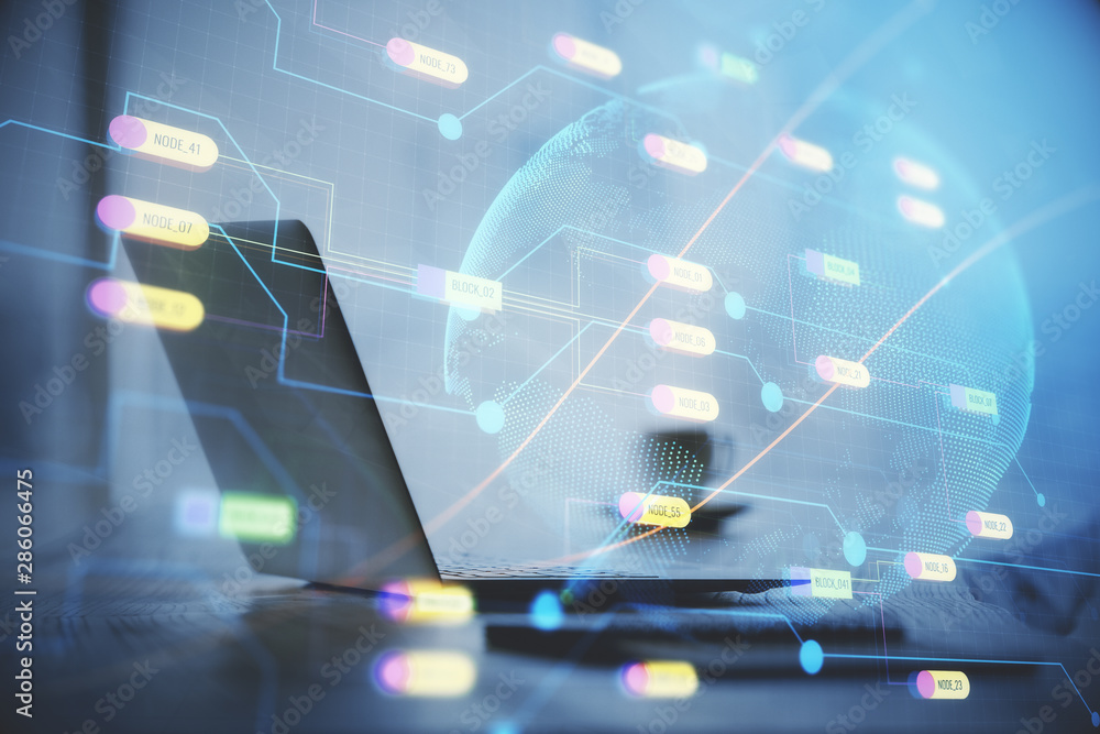 Double exposure of desktop with computer and world map hologram ...