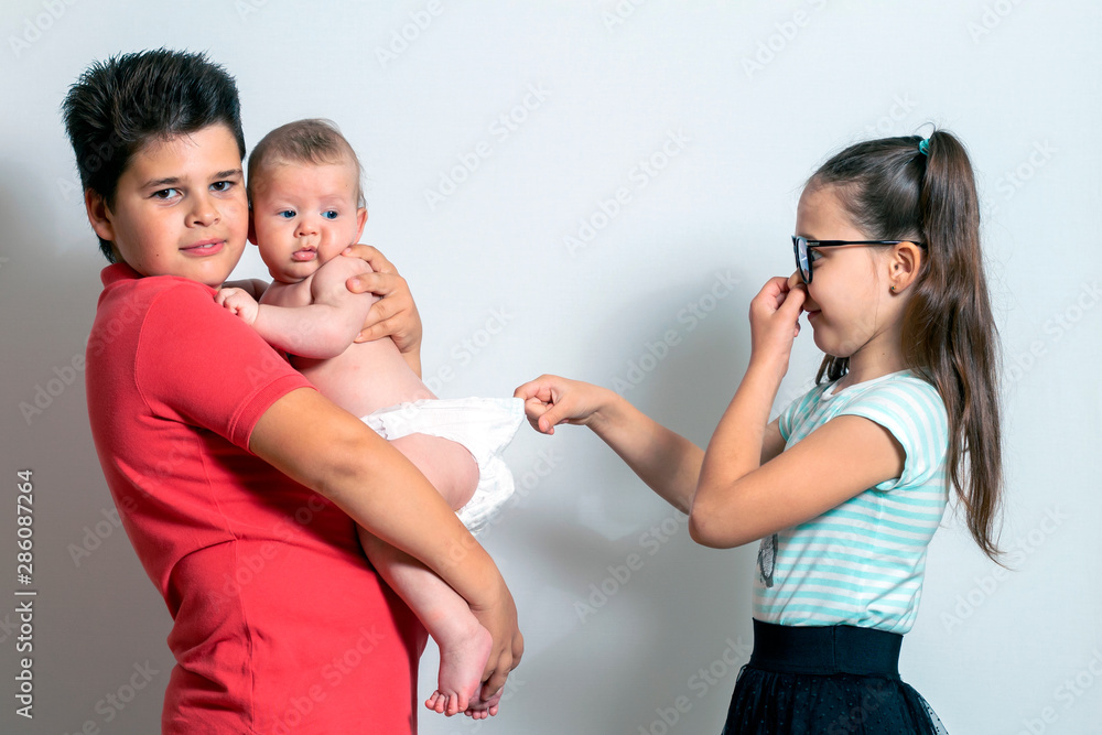 Children change the baby's diaper. Bad smell Stock Photo | Adobe Stock
