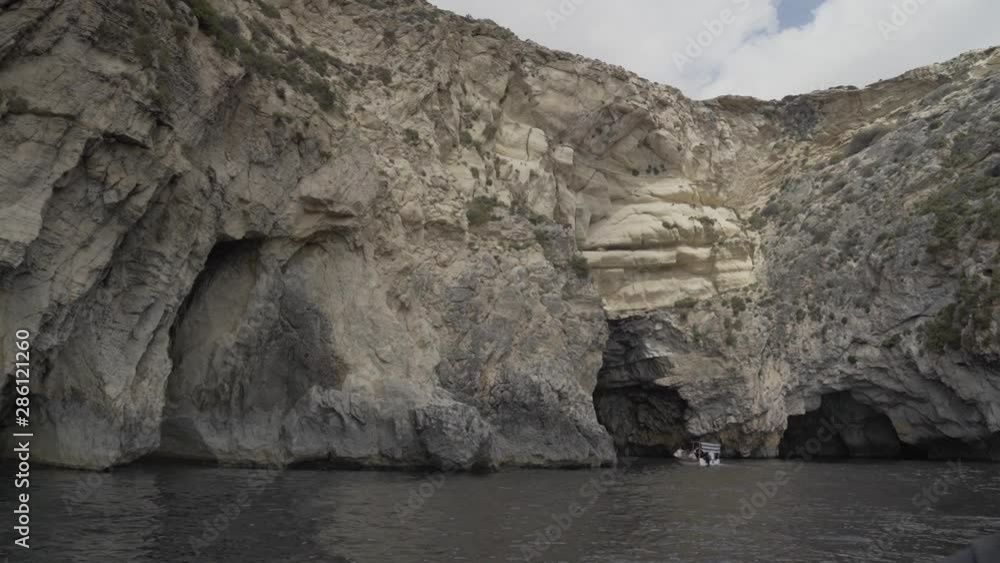 astonishing view of the Blue Grotto caverns, natural rock arch ...