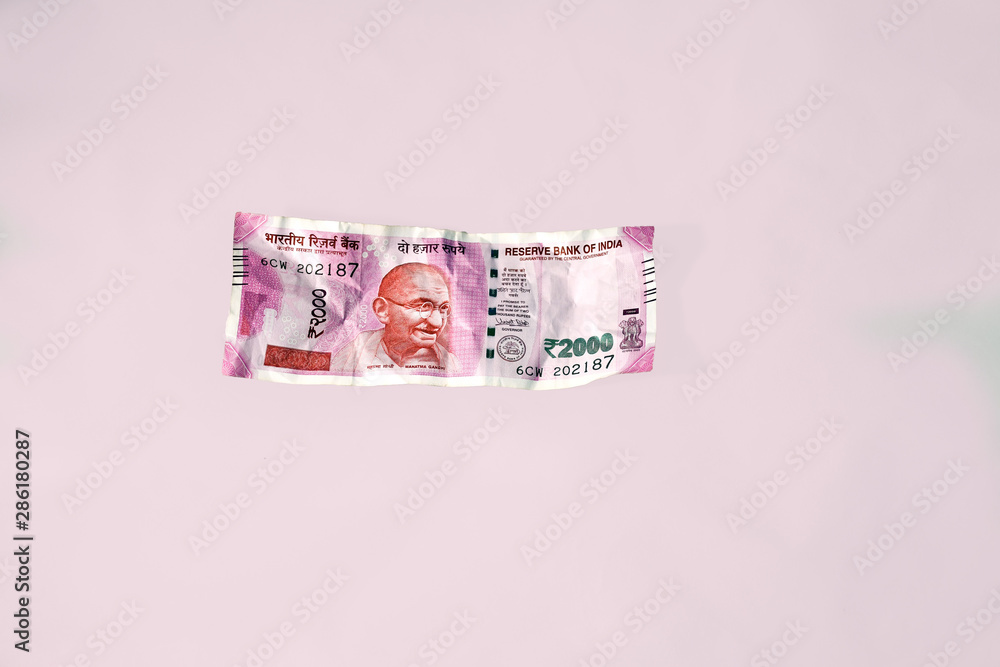 wrinkled modern Indian Two Thousand Rupees Currency Note on a minimal ...
