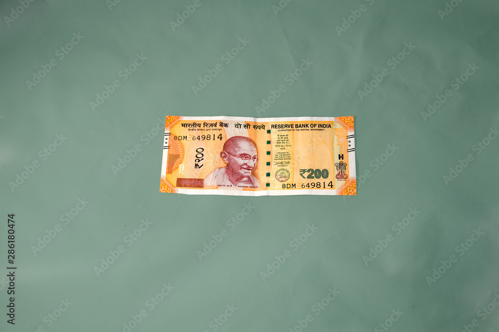 Modern Indian Two Hundred Rupees Currency Note on a minimal green ...
