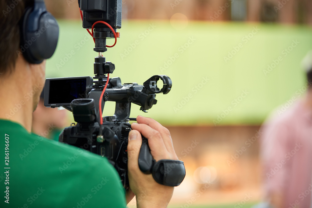 Behind the scenes of filming movies or video products. The operator ...
