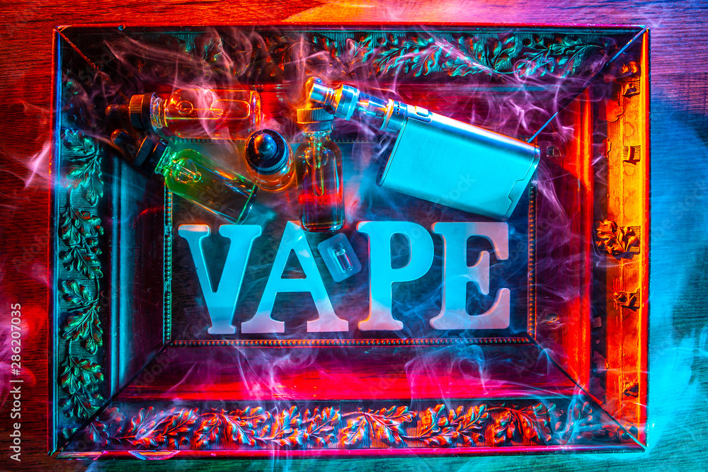 The vaping concept. White letters of the Latin alphabet and accessories ...