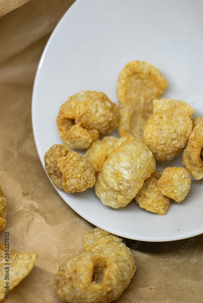 Crispy pork crackers. Thai food or snack made from pork skin, seasoned ...
