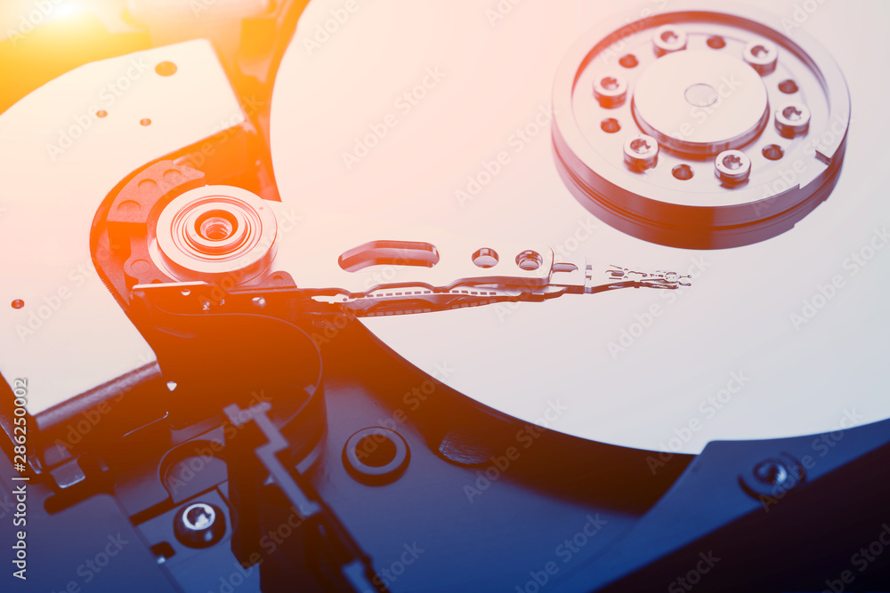 Closeup macro photo of head in opened hard disk drive. Concept of ...