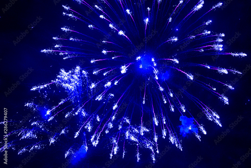Blue fireworks in the night sky Stock Photo | Adobe Stock