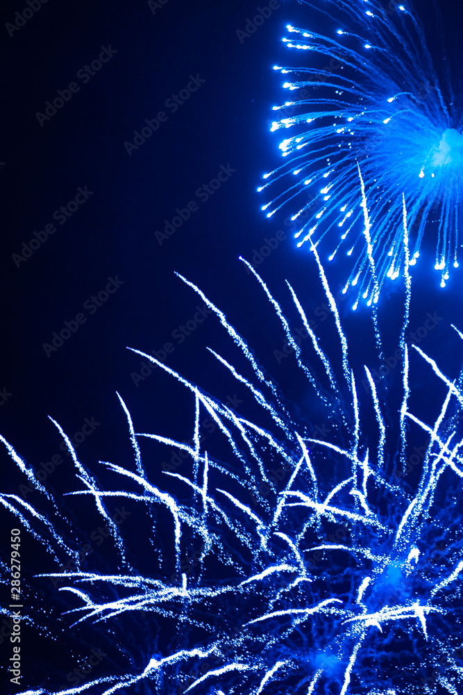 Blue fireworks in the night sky Stock Photo | Adobe Stock