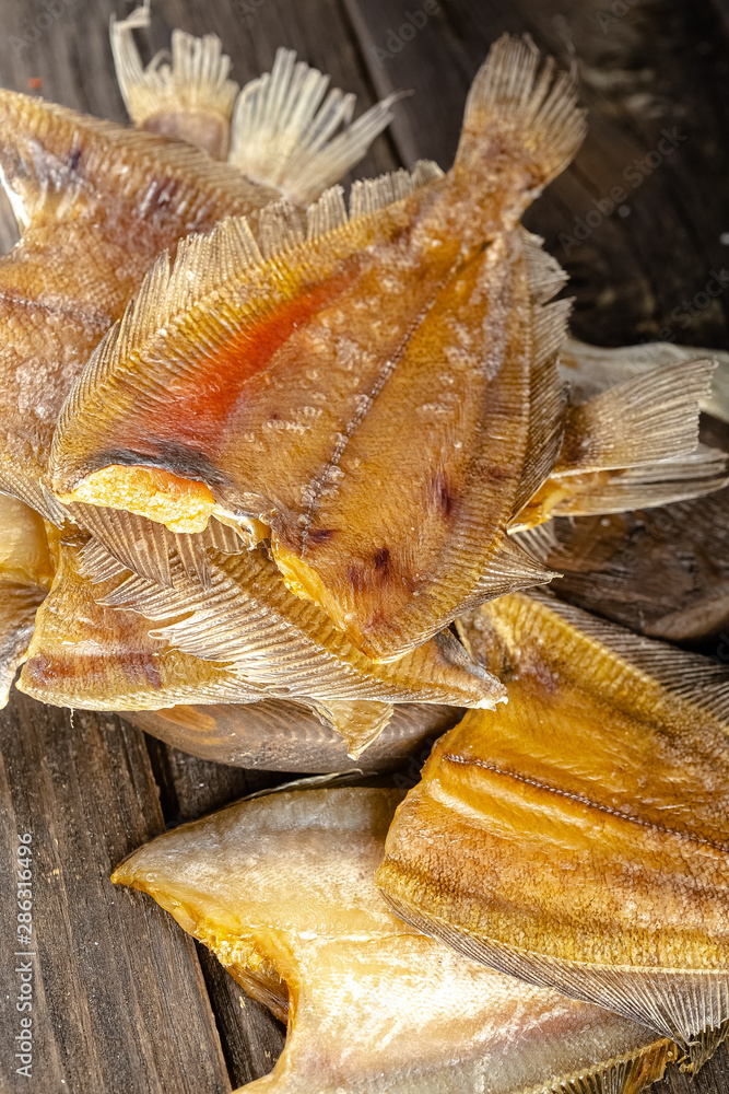 dried lumped fish, flounder with caviar, from different angles, stand ...