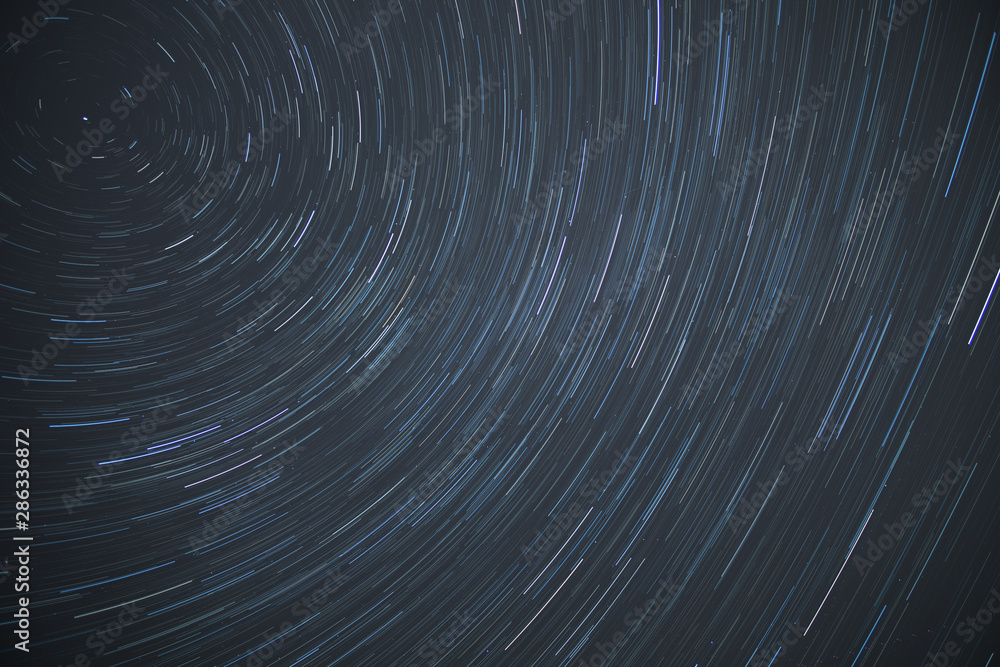 Astro photography time lapse of star trails rotating around the north ...