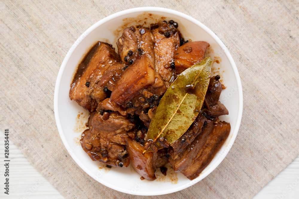 Homemade Filipino Adobo Pork in a bowl, top view. Flat lay, from above ...