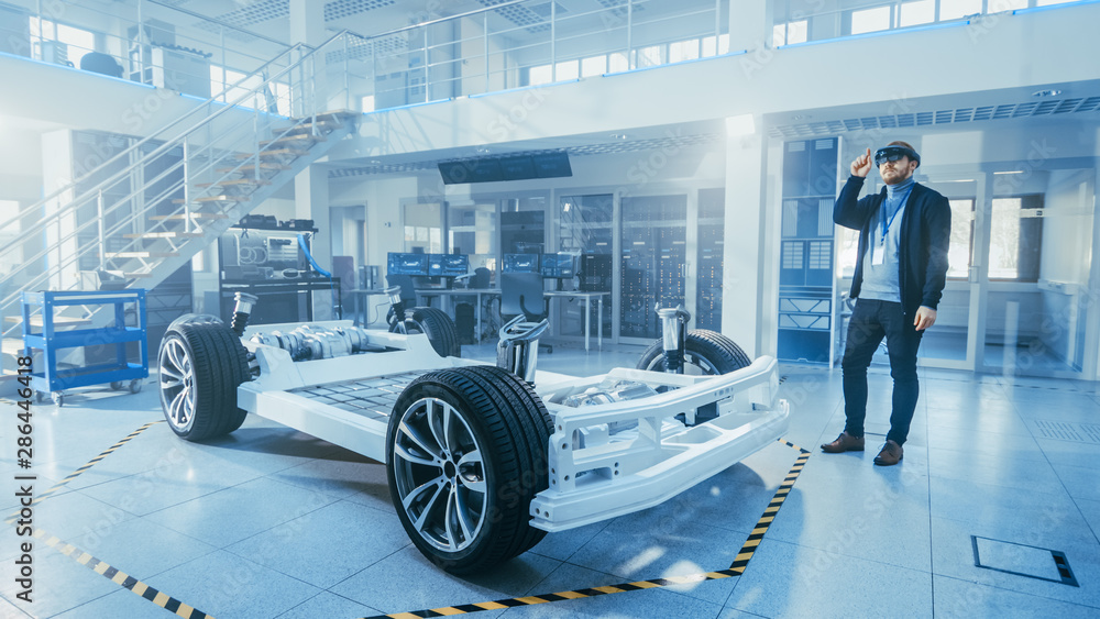 Automotive Engineer Working on Electric Car Chassis Platform, Using ...