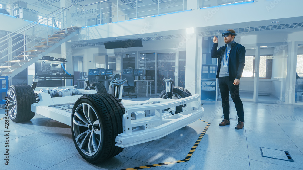 Automotive Engineer Working on Electric Car Chassis Platform, Using ...