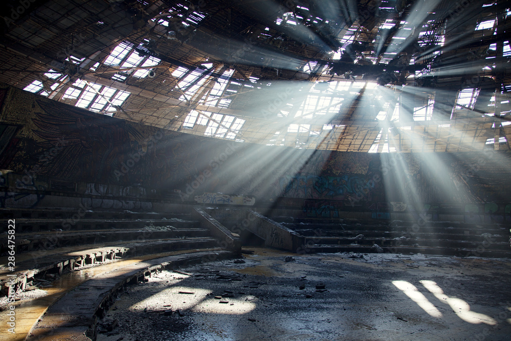 Rays of light through the roof of abandoned soviet building Stock Photo ...