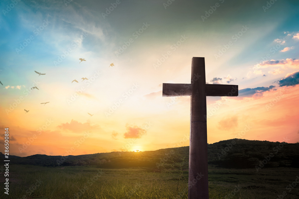 Religious concept: Jesus Christ wooden cross with dramatic lighting ...